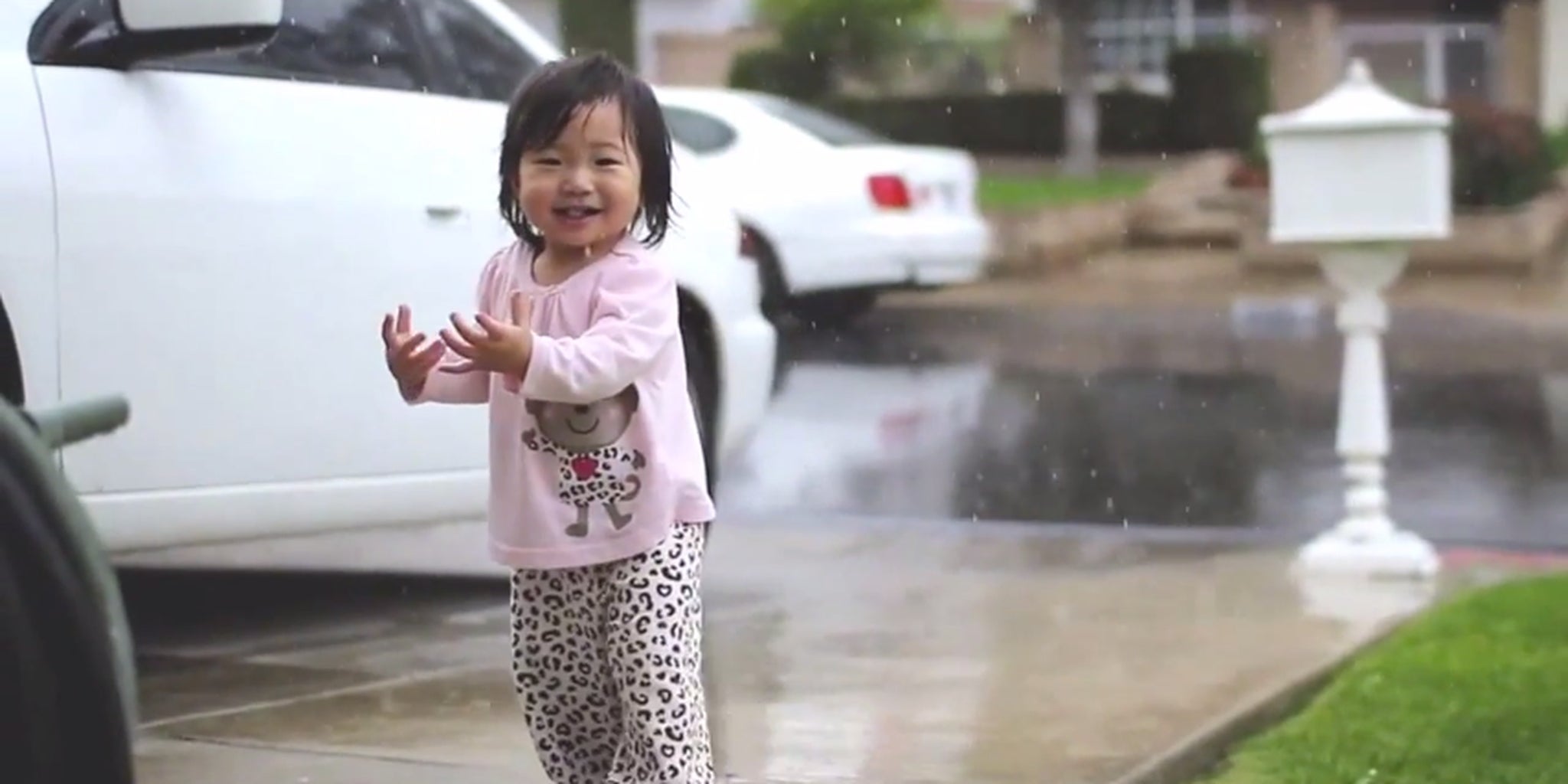 Watch this toddler freak out as she plays in the rain for the first ...
