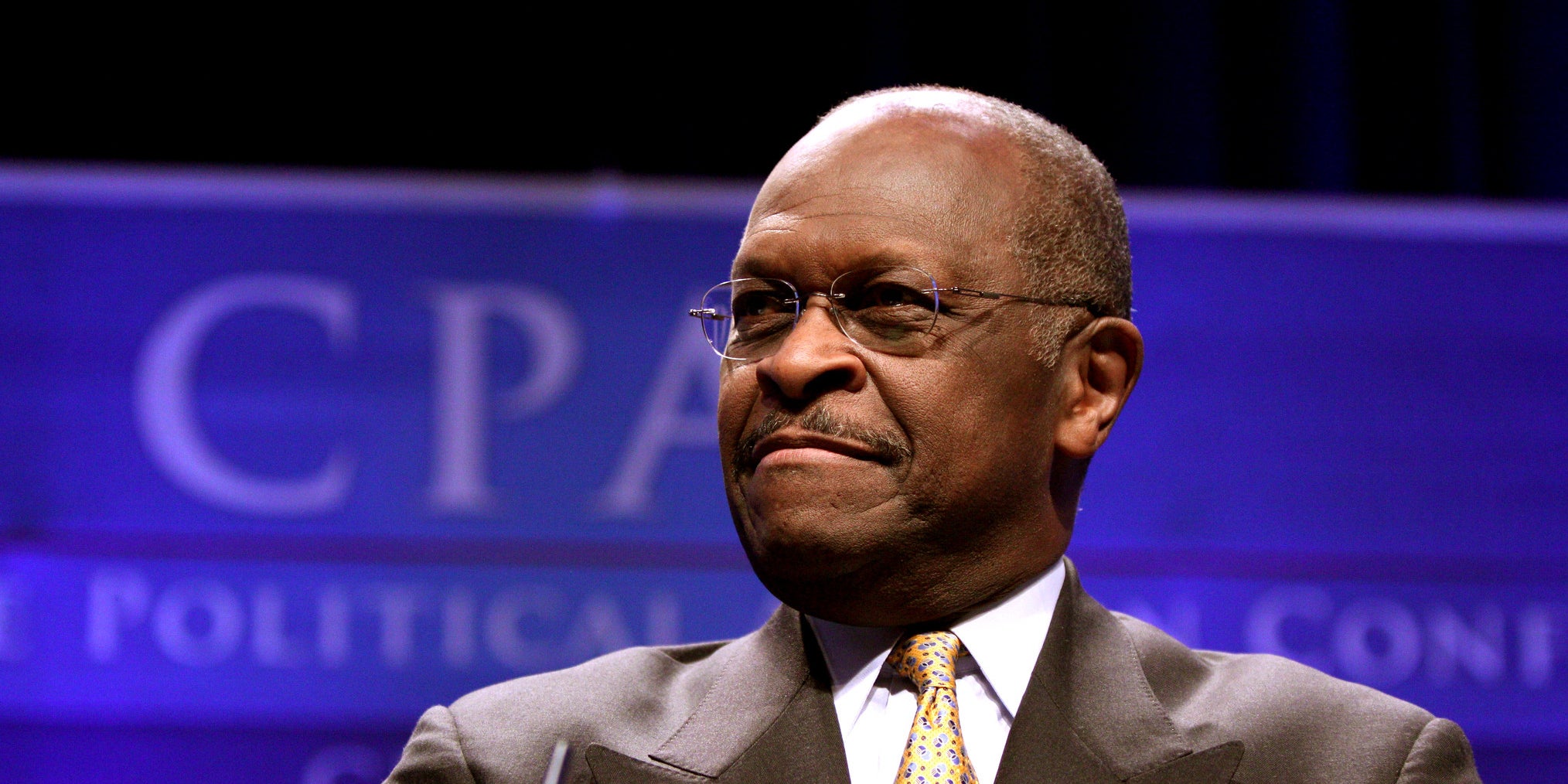 Herman Cain Diagnosed With COVID-19 Days After Attending Trump Rally