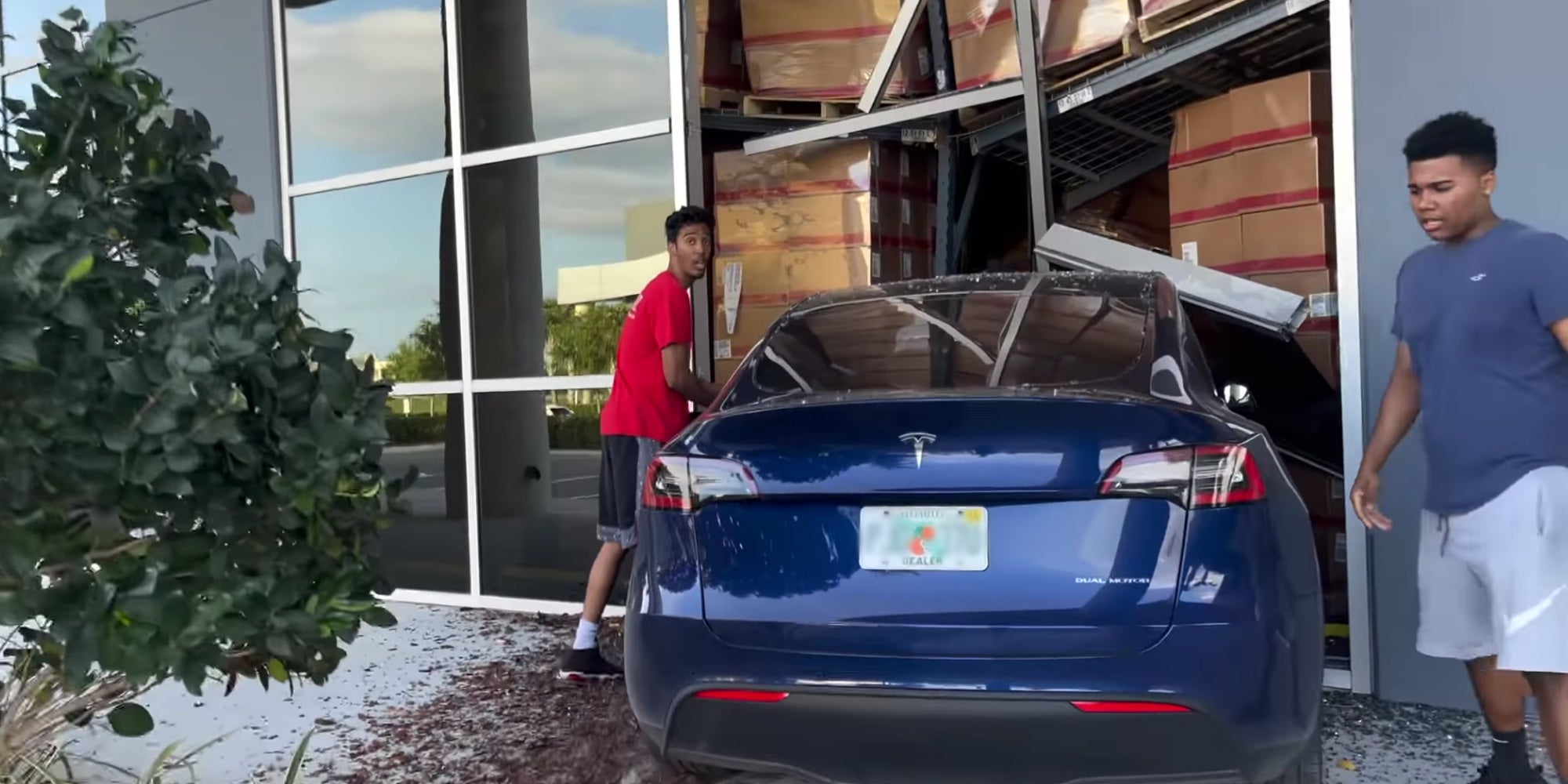 YouTuber Drives Tesla Into Building in Viral Video, Sparking Outrage