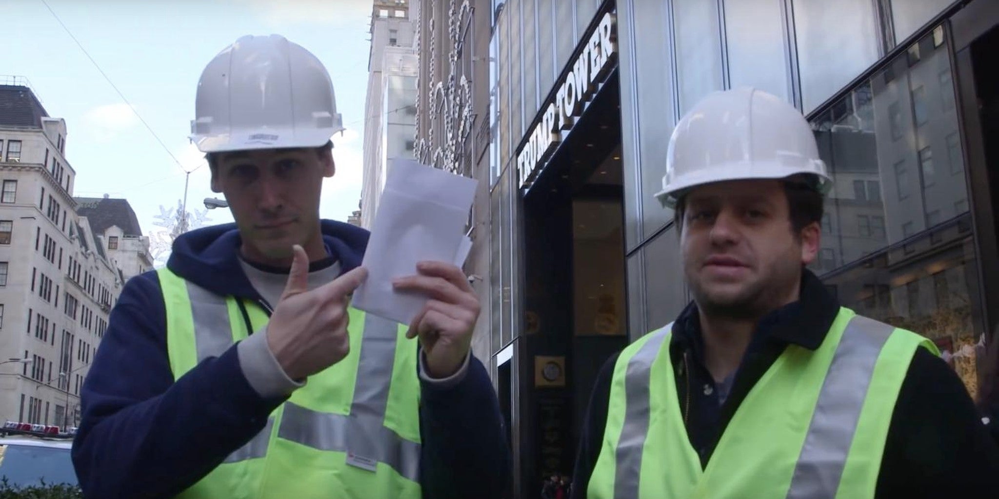 Watch these construction guys try to build a wall around Trump Tower