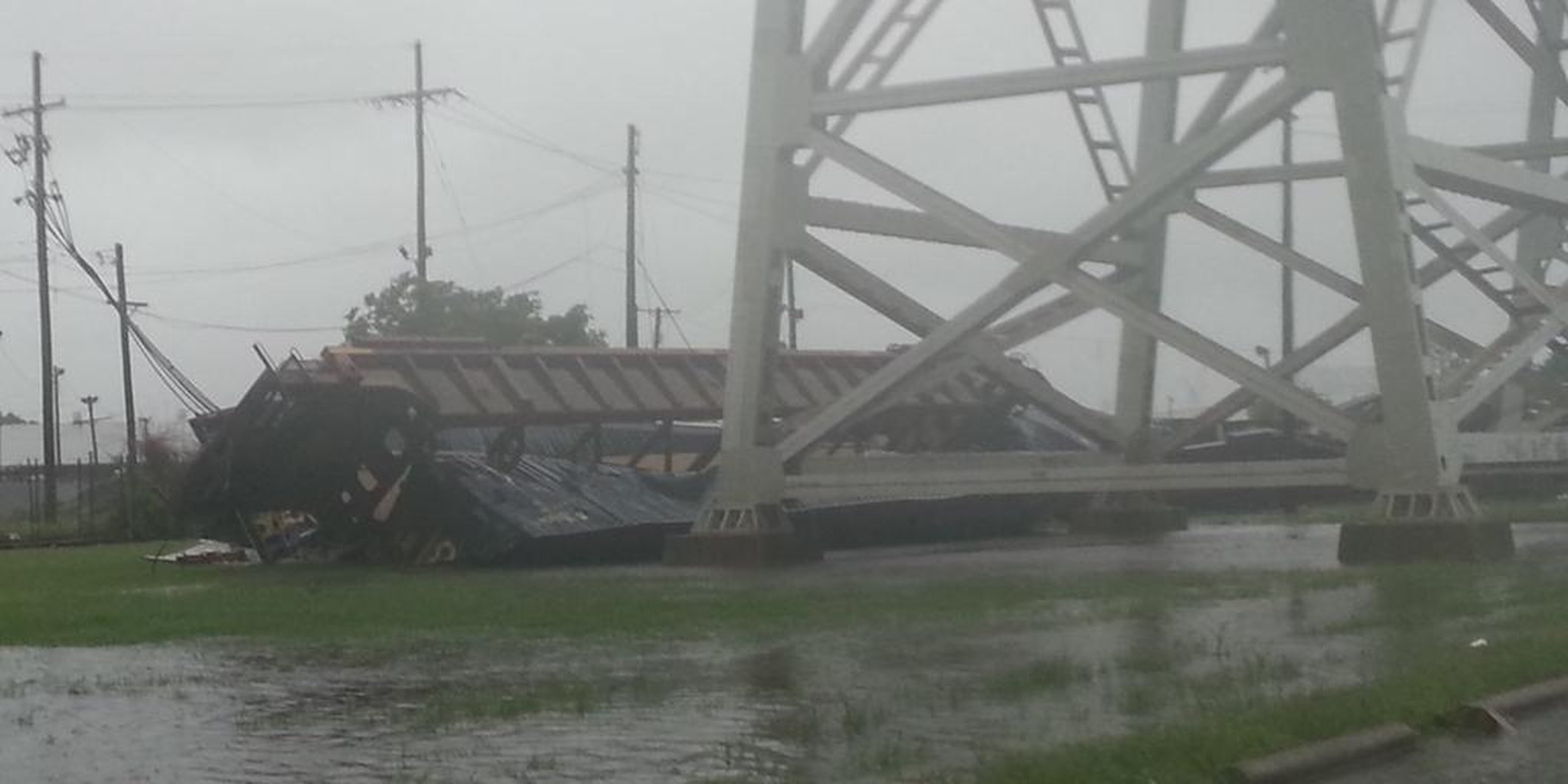 Massive wind gusts blow train off bridge in New Orleans