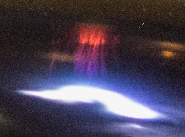 ISS astronaut photographs a super-rare 'red sprite' above a lighting storm